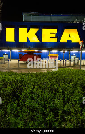 Large yellow IKEA logo sign on the side of blue building Stock Photo ...