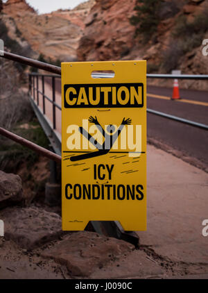 Roadside sign in icy conditions, indicating a risk of ice to cars Stock ...