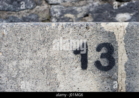 Number Thirteen on Stone Wall Stock Photo - Alamy