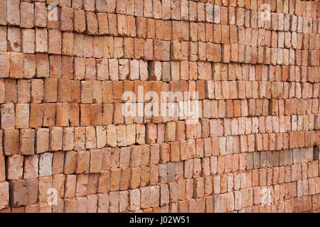 big stack of red clay block for wall construction, texture Stock Photo ...