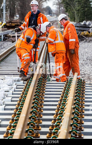 Rail construction workers installing new tracks and points Stock Photo ...