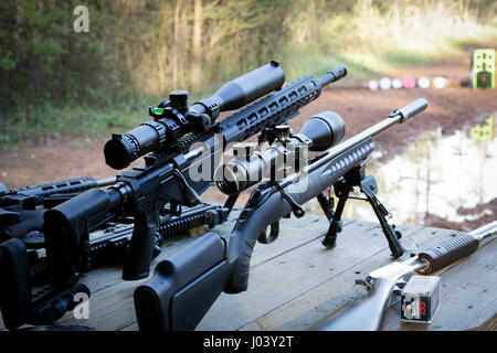 Ruger American Standard rifle with scope and supressor and pump-action ...