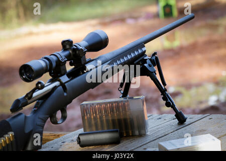 Ruger American Standard rifle with scope and supressor and pump-action ...