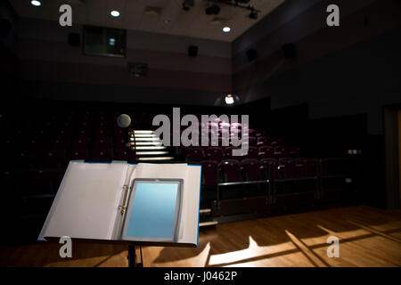Empty auditorium with podium and speaker on stage Stock Photo - Alamy