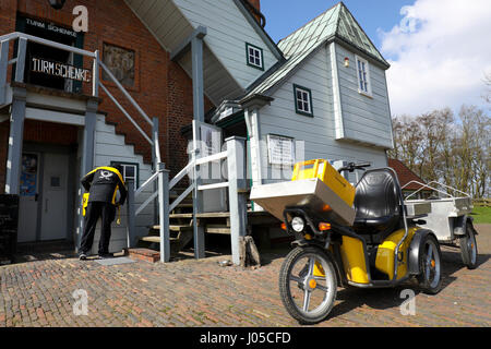Mailman Michael Stobbe delivers the mail with his electric vehicle on ...
