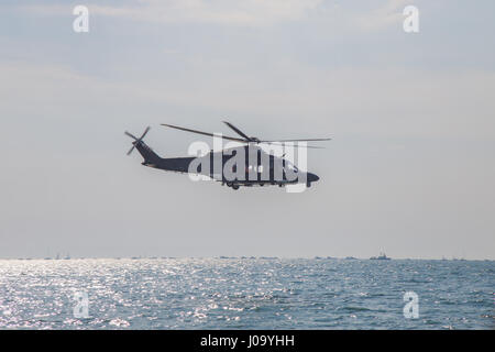 Helicopter hovering over water while taking off; Queen Charlotte Stock ...