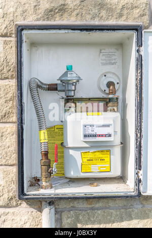 Gas meter for a domestic gas supply in cupboard on wall outside Stock ...