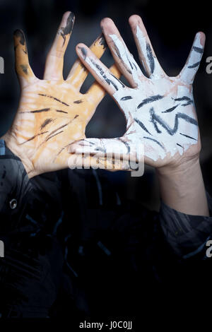 Two human aggressive painted hands in black Stock Photo - Alamy