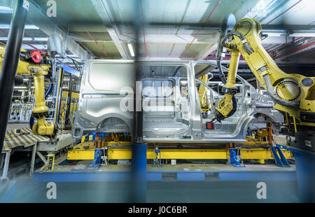 robot arm work on car factory or manufacturing line. Robotic hand ...