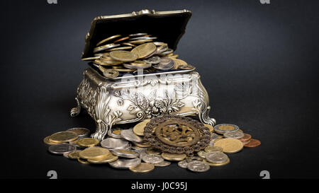 Little metal chest filled up with coins bringing good fortune Stock ...