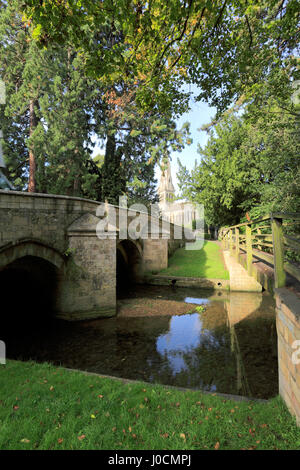 River Chater stone bridge, St Marys church, Ketton village Rutland ...