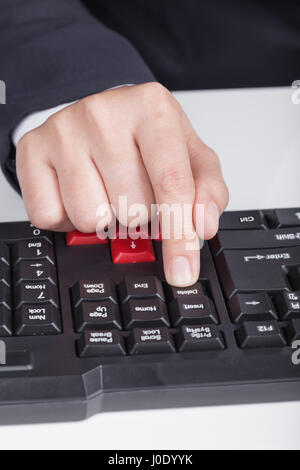 finger pushing delete button on a keyboard of computer Stock Photo - Alamy