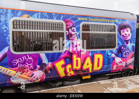 Merseyrail electric train covered in Beatles logos Stock Photo - Alamy
