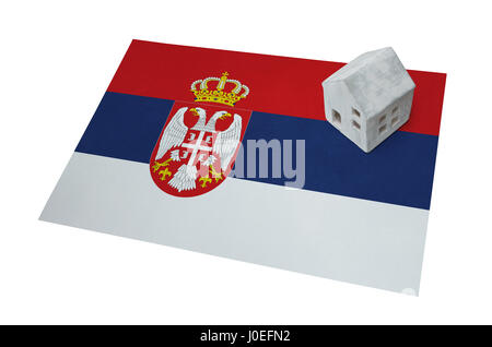 Small house on a flag - Serbia Stock Photo - Alamy