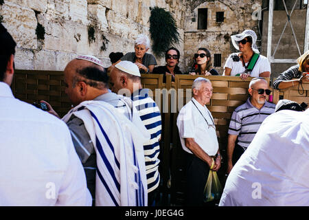 Jewish men and women pray in separate sections of the Wailing Wall ...
