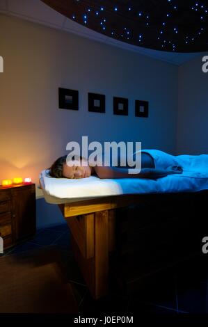 woman doing color therapy chromotherapy in spa room Stock Photo - Alamy
