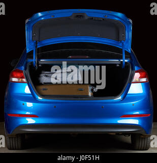 Full loaded car sedan trunk with bags isolated on black background ...