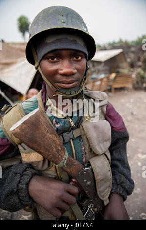 A DRC national army (FARDC) soldier at a checkpoint on the frontline ...