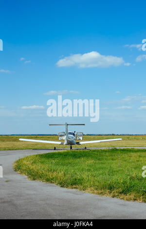 Small airplane on the sport grass airfield in Nowy Targ. Tatra mountain ...