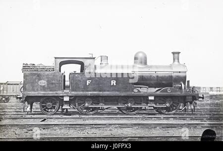 Furness Railway 0-6-0 steam engine hauling a passenger train at Stock ...