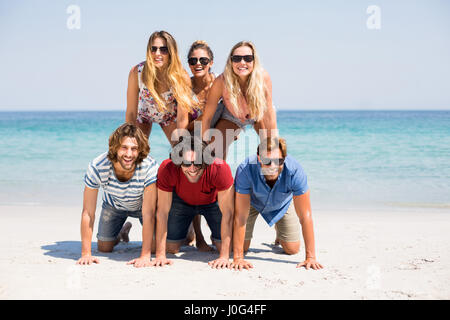 Human pyramid on the beach Stock Photo - Alamy