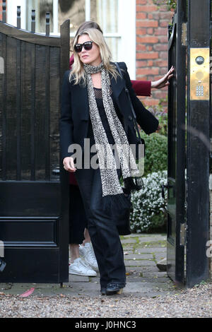 Kate Moss leaves her North London home with her driver carrying what ...
