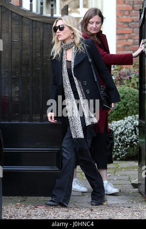 Kate Moss leaves her North London home with her driver carrying what ...