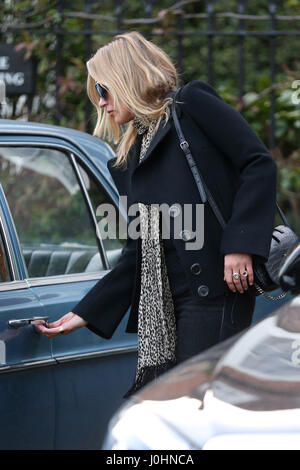 Kate Moss leaves her North London home with her driver carrying what ...