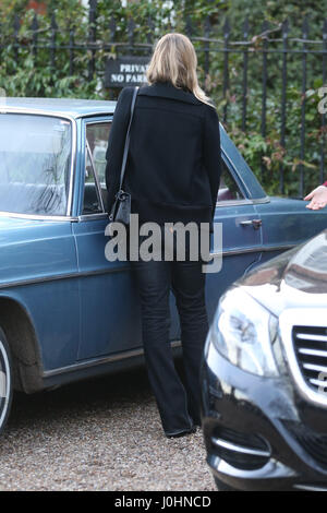 Kate Moss leaves her North London home with her driver carrying what ...