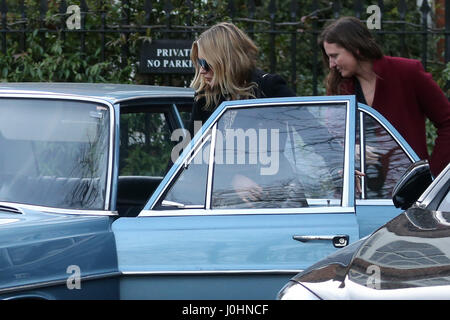 Kate Moss leaves her North London home with her driver carrying what ...