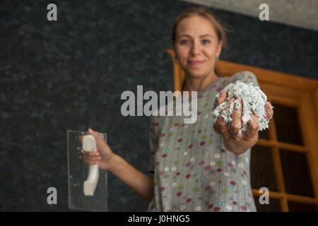 Pasting liquid wallpaper in the apartment Stock Photo - Alamy