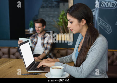 Young beautiful hispanic woman having online legs training class at ...