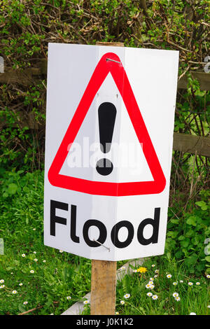 Flooding Ahead Road Sign: A Caution Sign in front of storm clouds ...