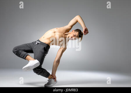 Young shirtless man performing contemporary dance position and Stock ...