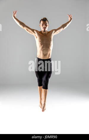Young shirtless man performing contemporary dance position and Stock ...