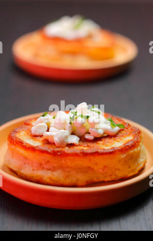 cottage cheese on clay dish with wooden spoon on kitchen tablecloth ...