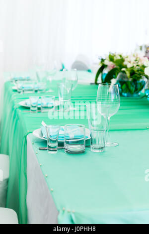 Served table layout green color Stock Photo - Alamy