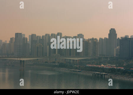 Chongqing, China - Dec 22, 2015: The view of foggy crowded city beside ...