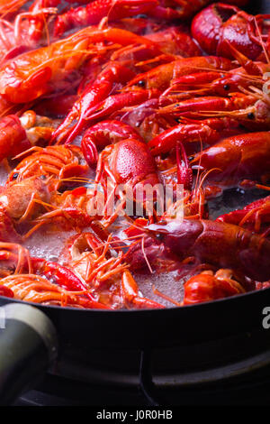 Crayfish are being cooked on a frying pan Stock Photo - Alamy