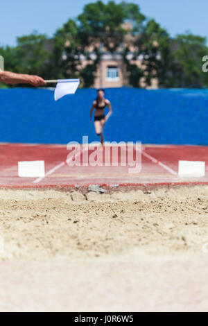Woman long jump competition Stock Photo - Alamy