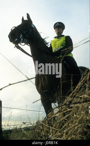British Police officers patrolling rural area of Suffolk and talking to ...