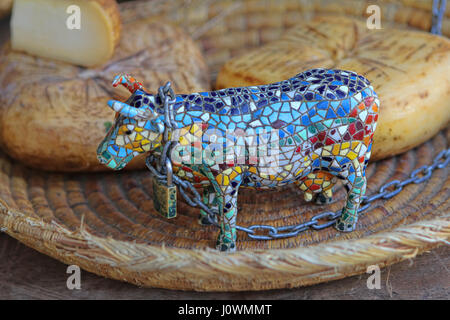 Traditional spanish souvenir - ceramic bull on a promenade in Malaga ...