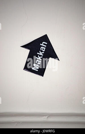 Arrow on a ceiling pointing into the direction of Mecca, for devout ...