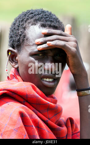 Close up of Maasai warrior s hand holding a traditional wooden rungu ...