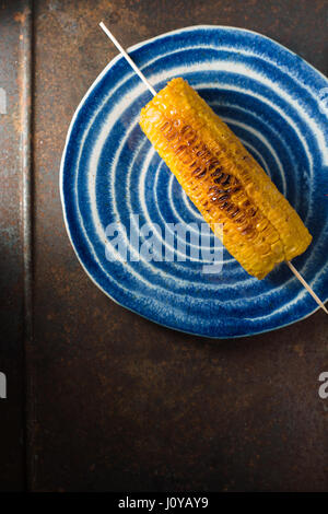 This photo of young sweet corn in yellow on a black background was ...