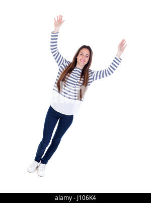 Happy teenager girl celebrating something leaving her hands isolated on ...