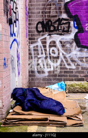 Cardboard boxes on the ground in an alleyway, used by homeless people ...