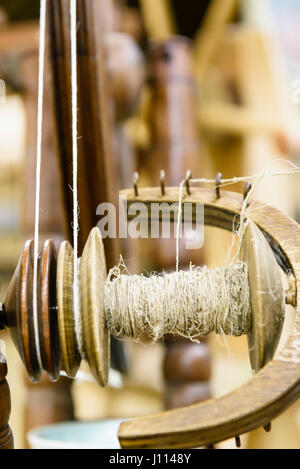 Linen thread being spun and wound onto a bobbin at the Wellbrook ...