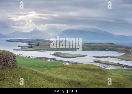 View from Canna Island of isolated houses and the island of Scalpay ...