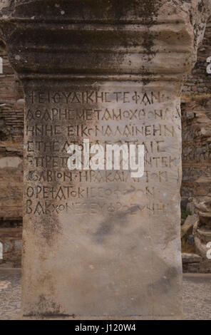 Greek inscription on the column in the ancient city of Ephesus in ...